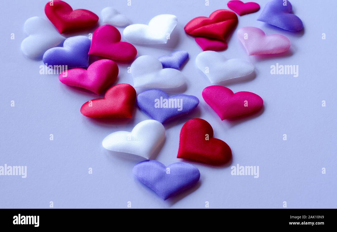 Hearts in different colors and sizes on white background Stock Photo ...