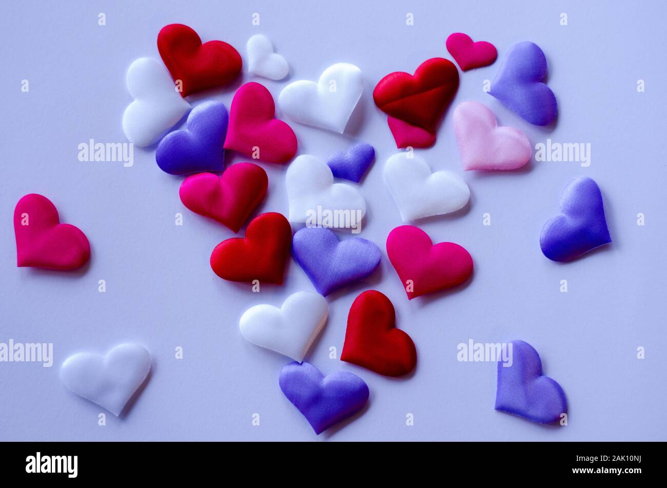 Hearts in different colors and sizes on white background Stock Photo ...
