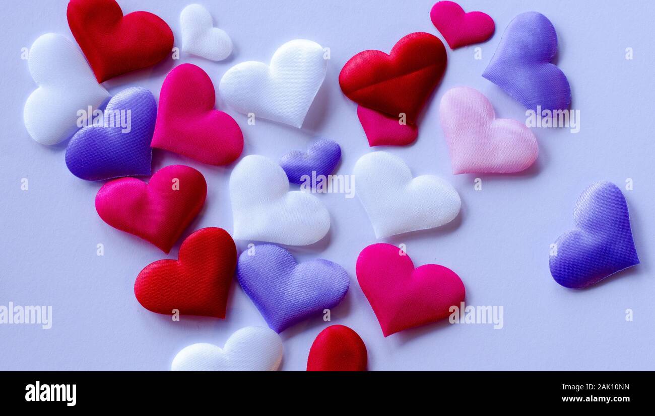 Hearts in different colors and sizes on white background Stock Photo ...