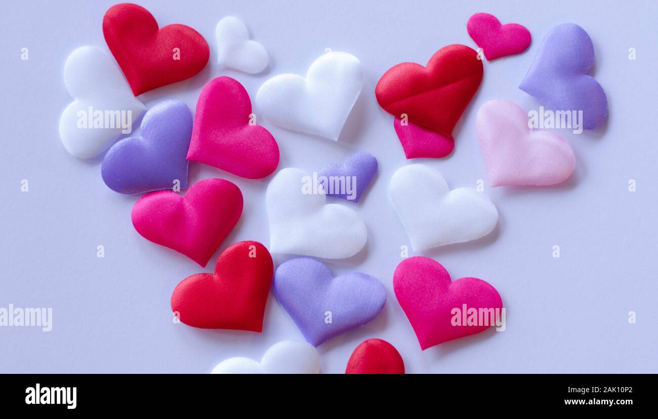 Hearts in different colors and sizes on white background Stock Photo ...