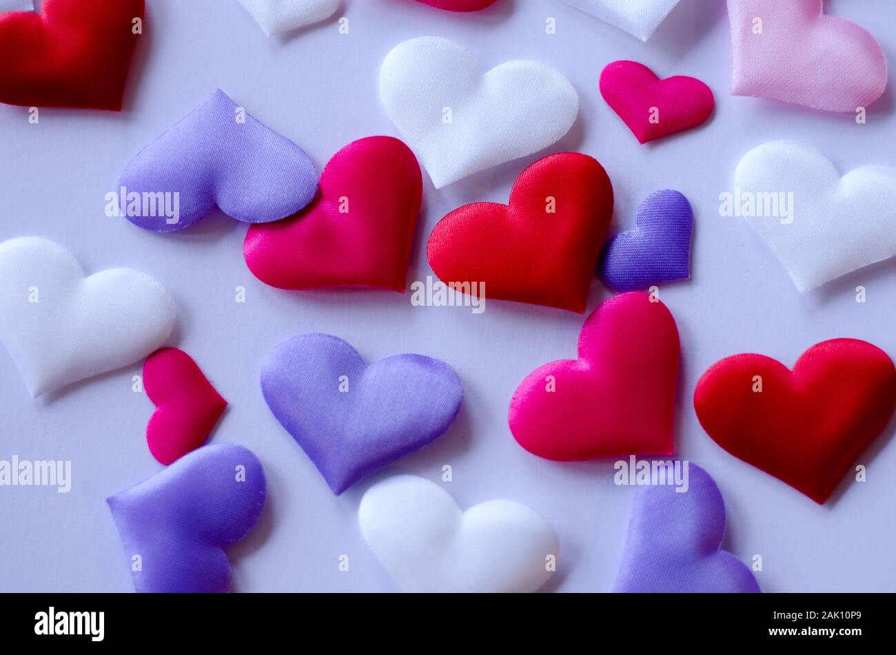 Hearts in different colors and sizes on white background Stock Photo ...