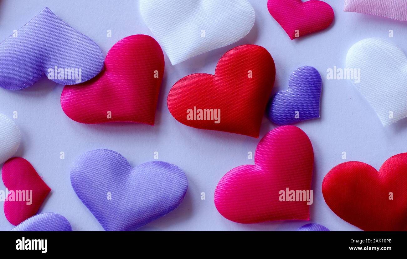 Hearts in different colors and sizes on white background Stock Photo ...