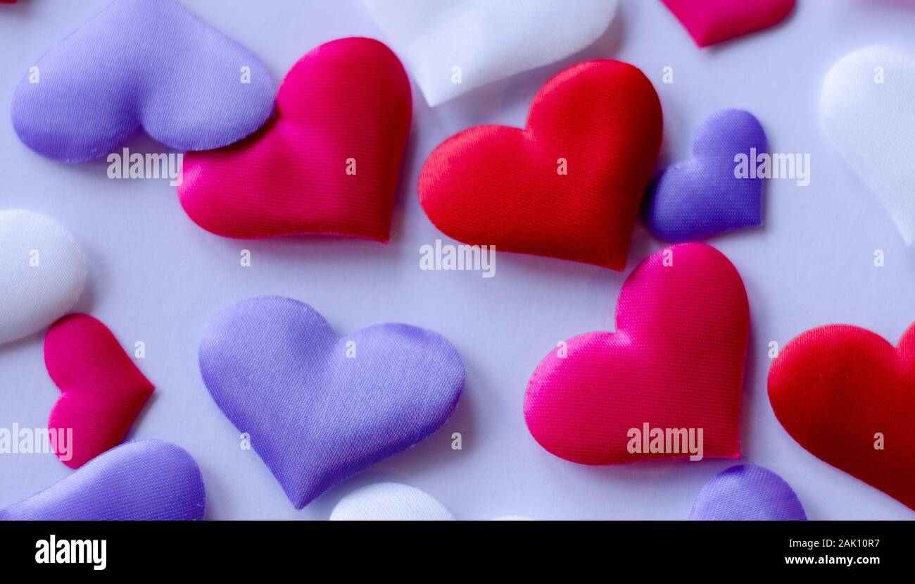 Hearts in different colors and sizes on white background Stock Photo ...