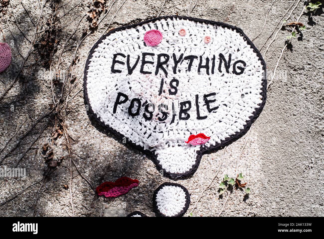 The inscription on the wall in knitted letters everything is possible ...