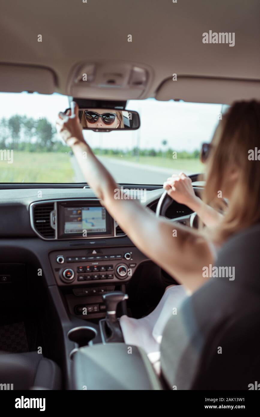 Woman driving reversing car looking hi-res stock photography and images ...