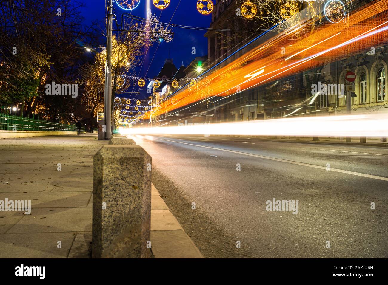 City lights and long exposure evening traffic in Bucharest, Romania ...