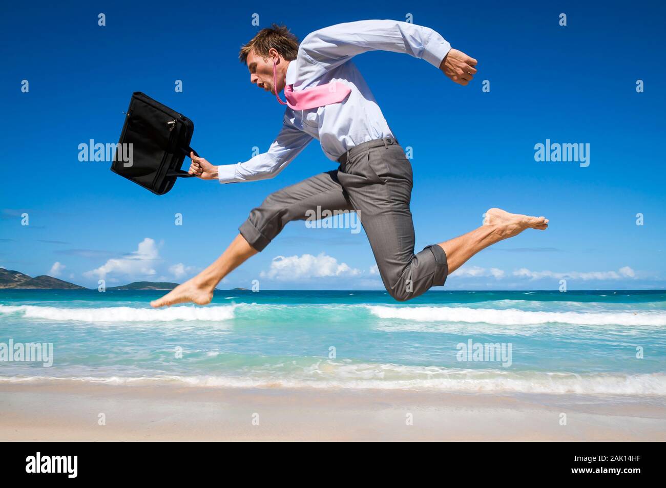 Man suit jumping laptop hi-res stock photography and images - Alamy