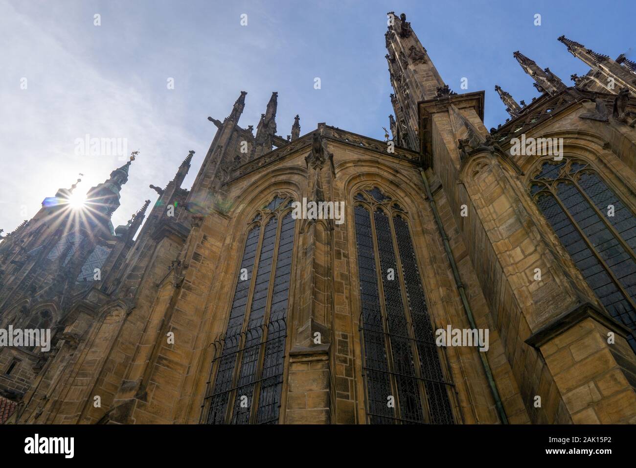 The spiers of the Gothic cathedral against the blue sky and white ...