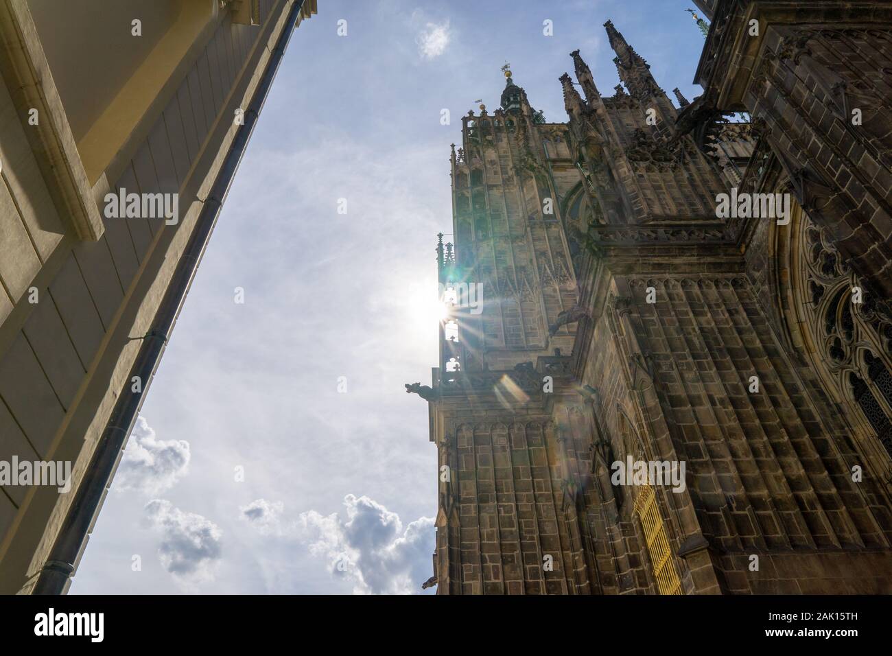 The spiers of the Gothic cathedral against the blue sky and white ...