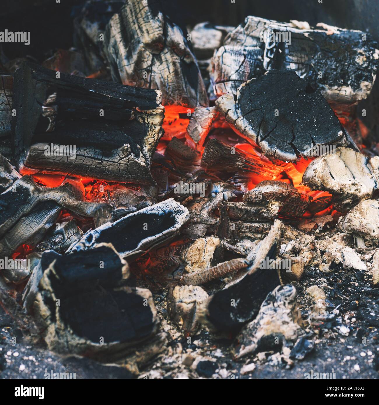 Smoldering coal close-up. Heat source Remains of a bonfire. The texture ...