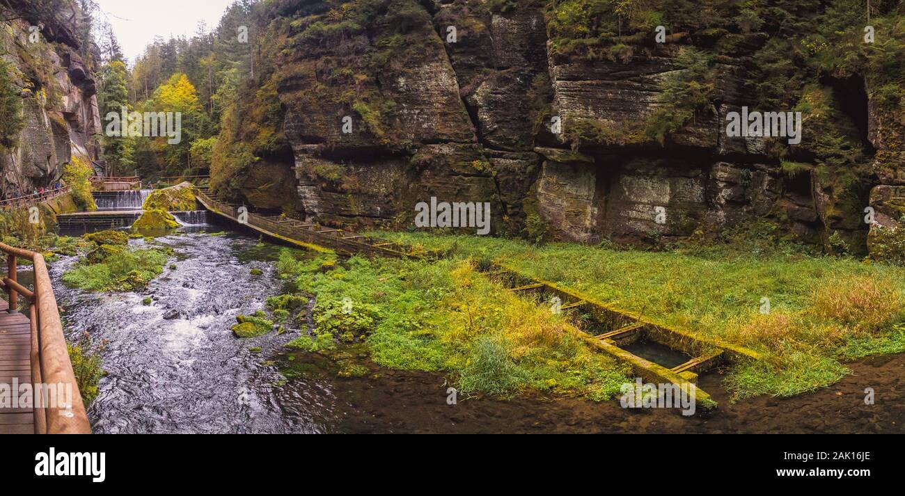 The Kamnitz Gorge - Fish ladder on river flowing through rocky ravine ...