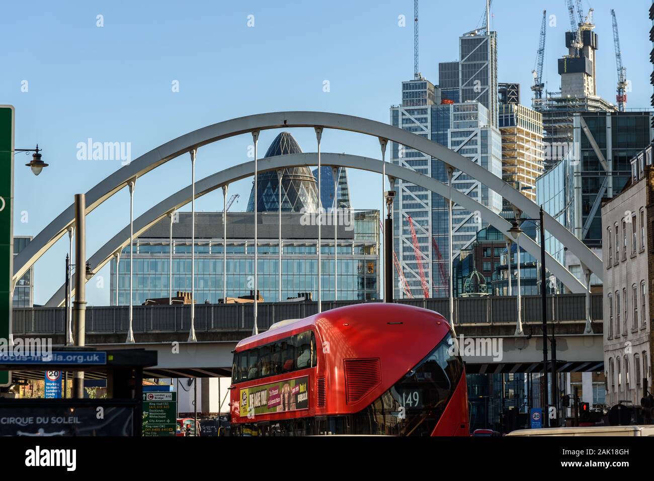 LONDON, ENGLAND, - 29th JUNE, 2018: London with red buses and financial ...