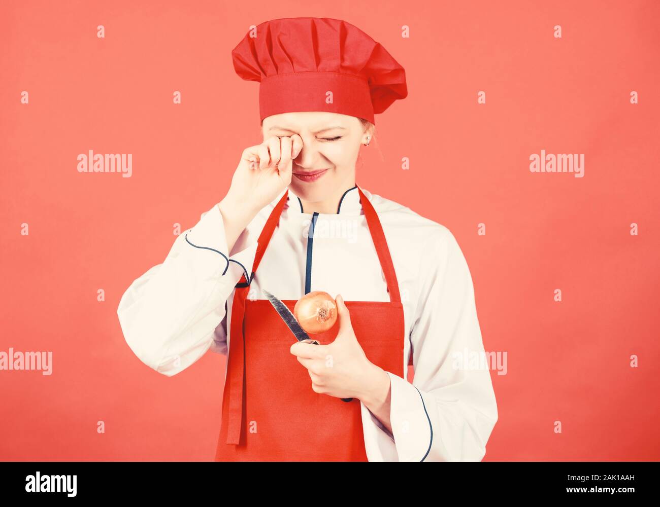 professional chef in kitchen crying. Cuisine. woman in cook hat and ...