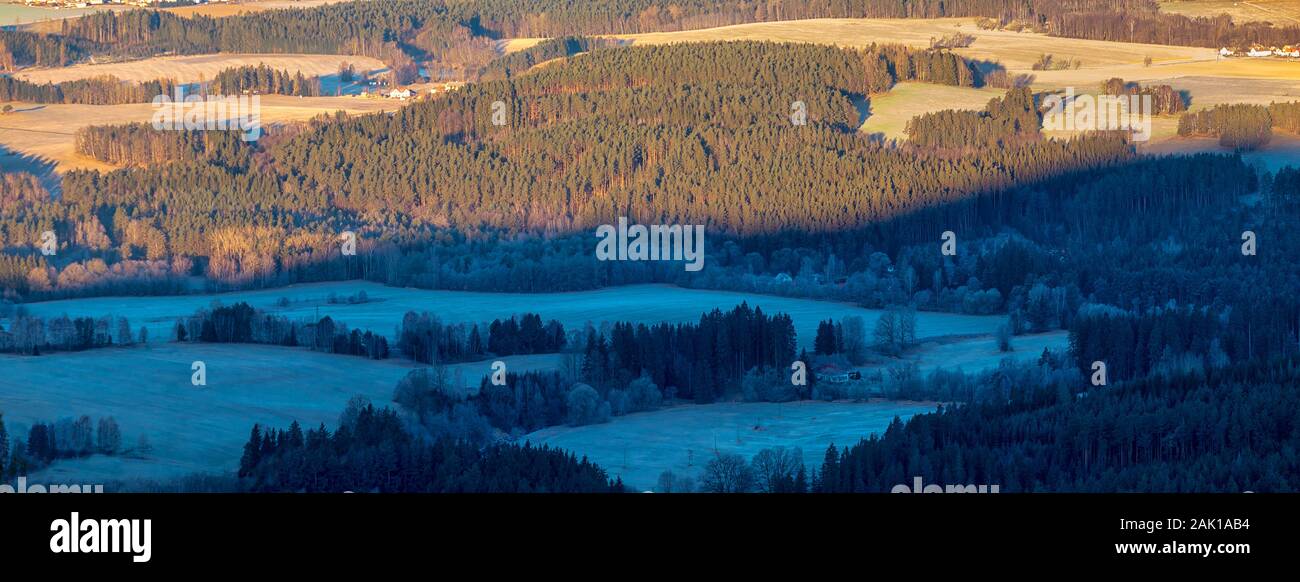 top view of the landscape with forests and meadows - half shaded and ...