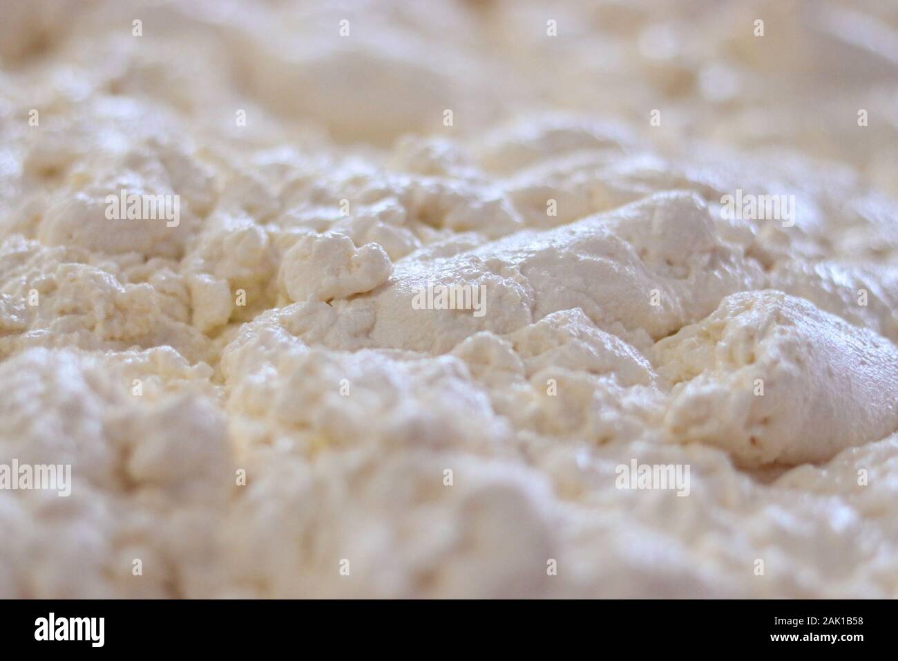 quark - a close-up view of the texture of cottage cheese mass in making ...