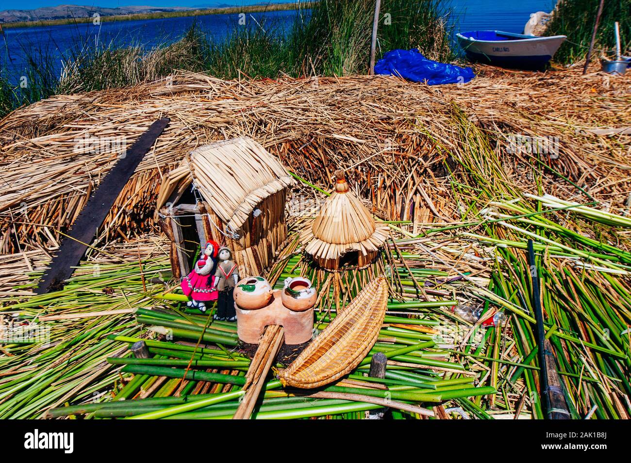 Straw huts and boats on one of the Titino Floating Islands on the ...