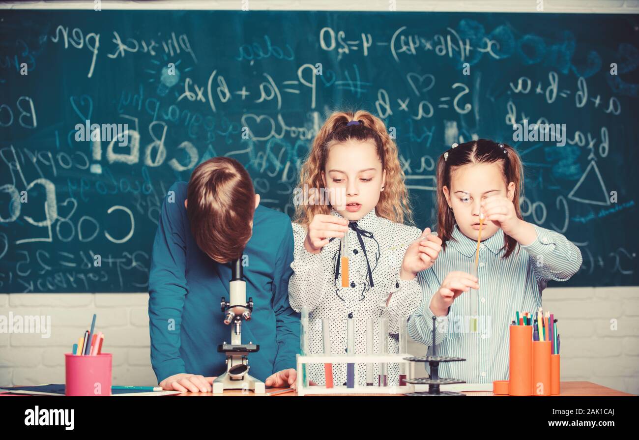 students biology experiments with microscope in lab. Chemistry ...