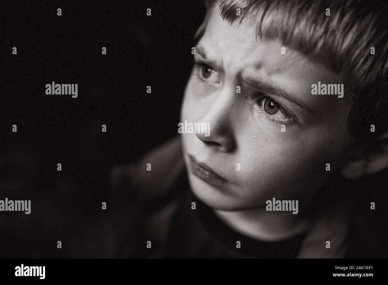 A little boy looks concerned Stock Photo - Alamy