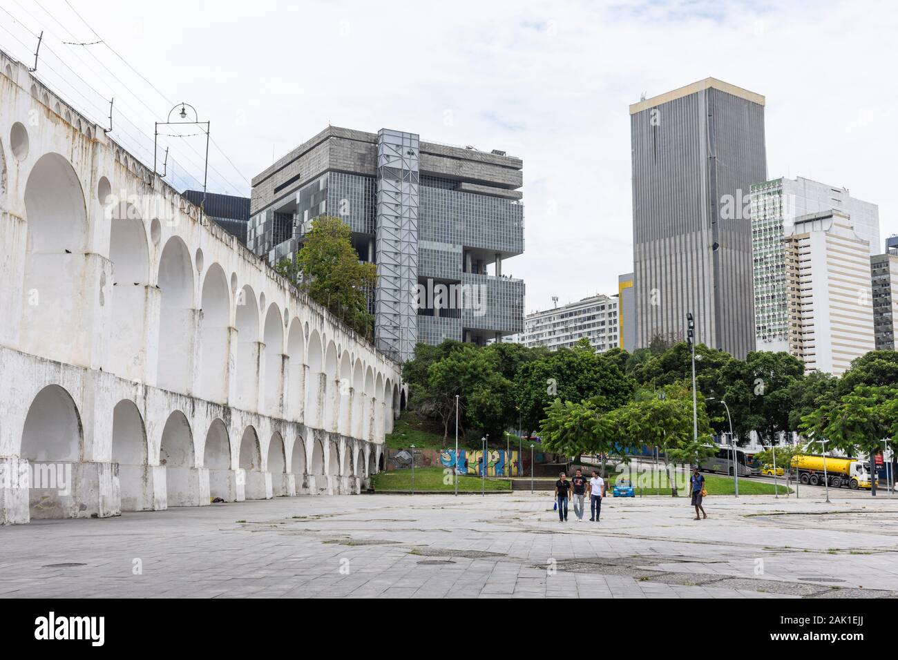 White and old historic Arcos da Lapa (Lapa Aqueduct) with big buildings ...