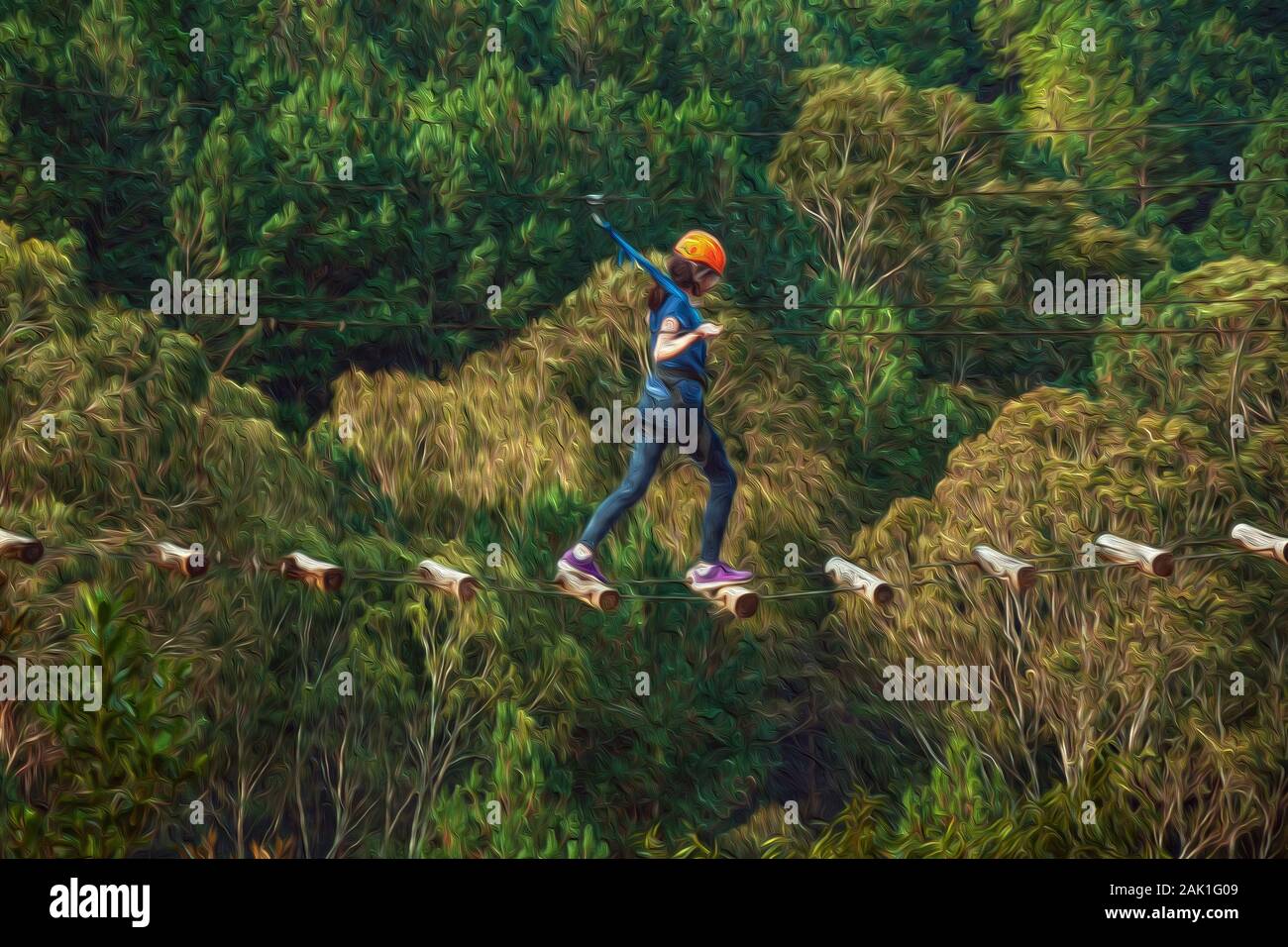 Fully equipped girl practicing tree climbing on cloudy day in a forest ...