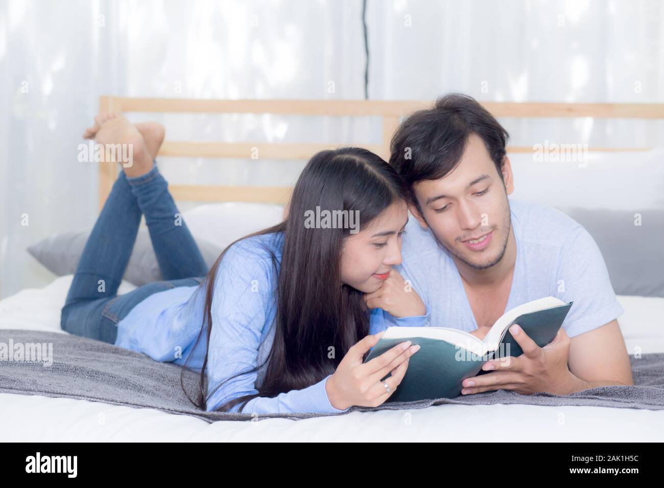 Romantic couple reading book on hi-res stock photography and images - Alamy
