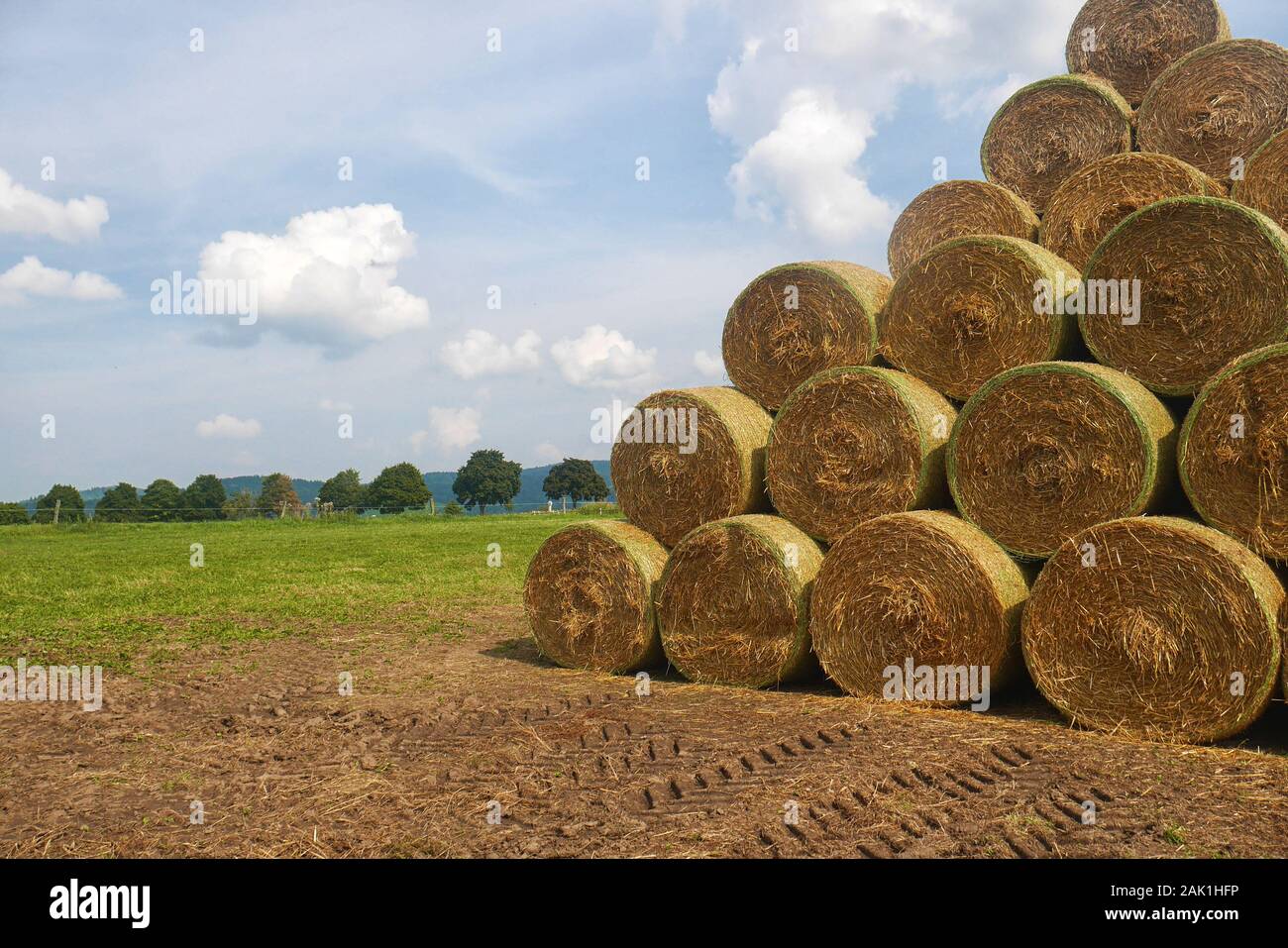 stack of straw bales - round straw bales stacked in a pyramid, on a ...