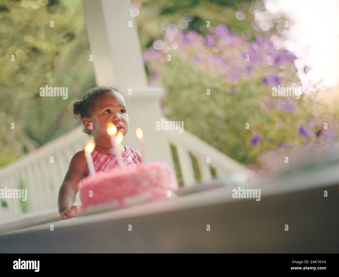 Small birthday girl with cake Stock Photo - Alamy