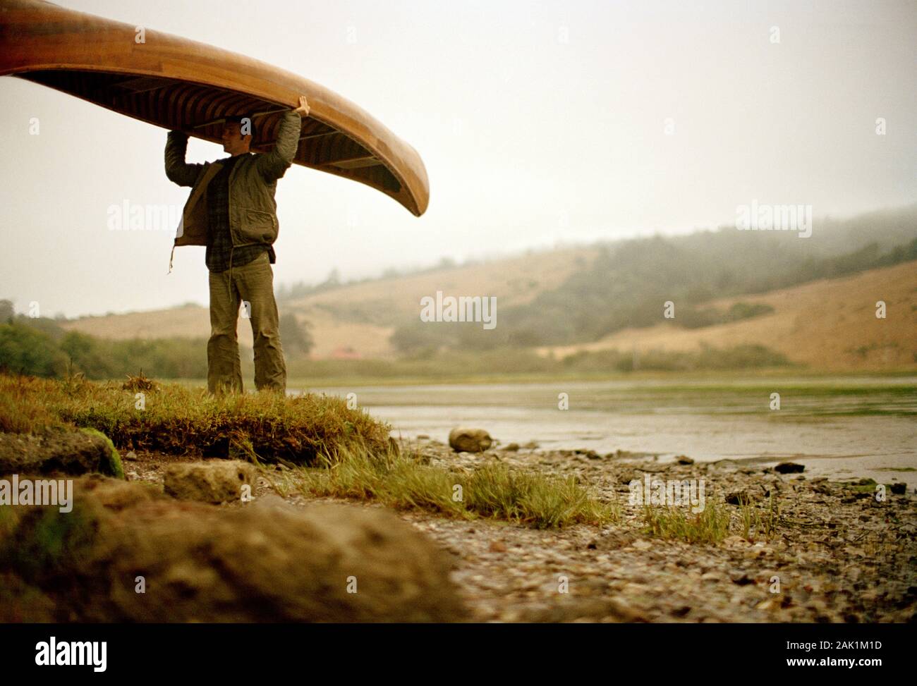 Man carrying canoe hi-res stock photography and images - Alamy