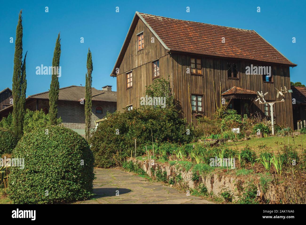 Wooden old house in a traditional rural style with garden on top of ...