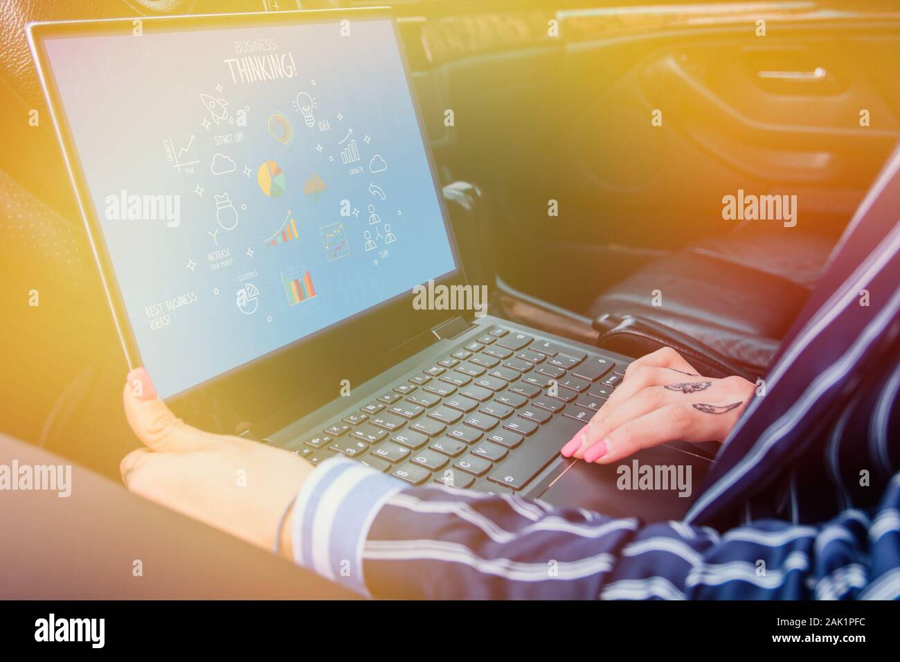Elegant woman with computer and designing her projects on business ...