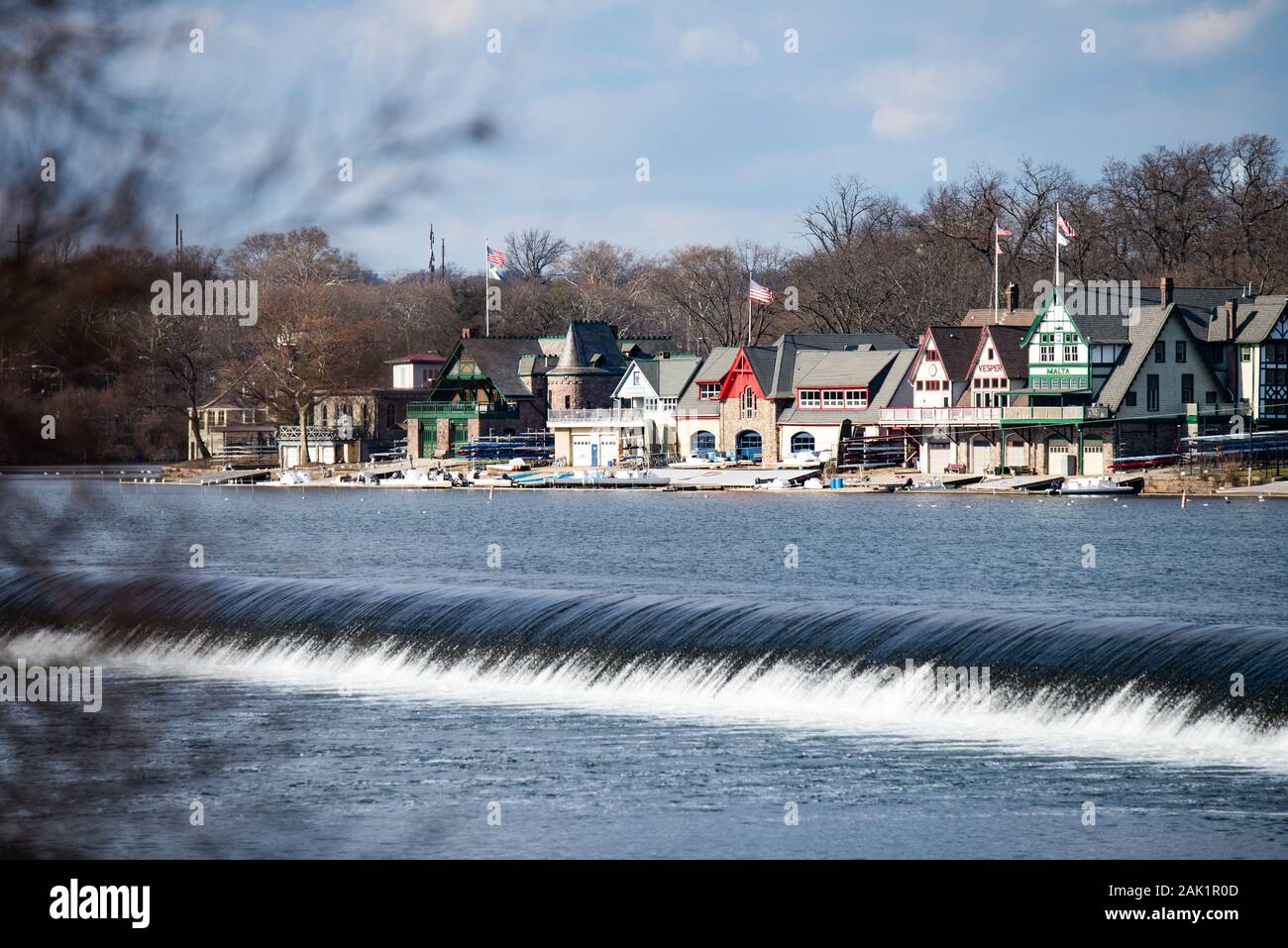 A view of Philadelphia's famous Boathouse Row visible behind the weir ...