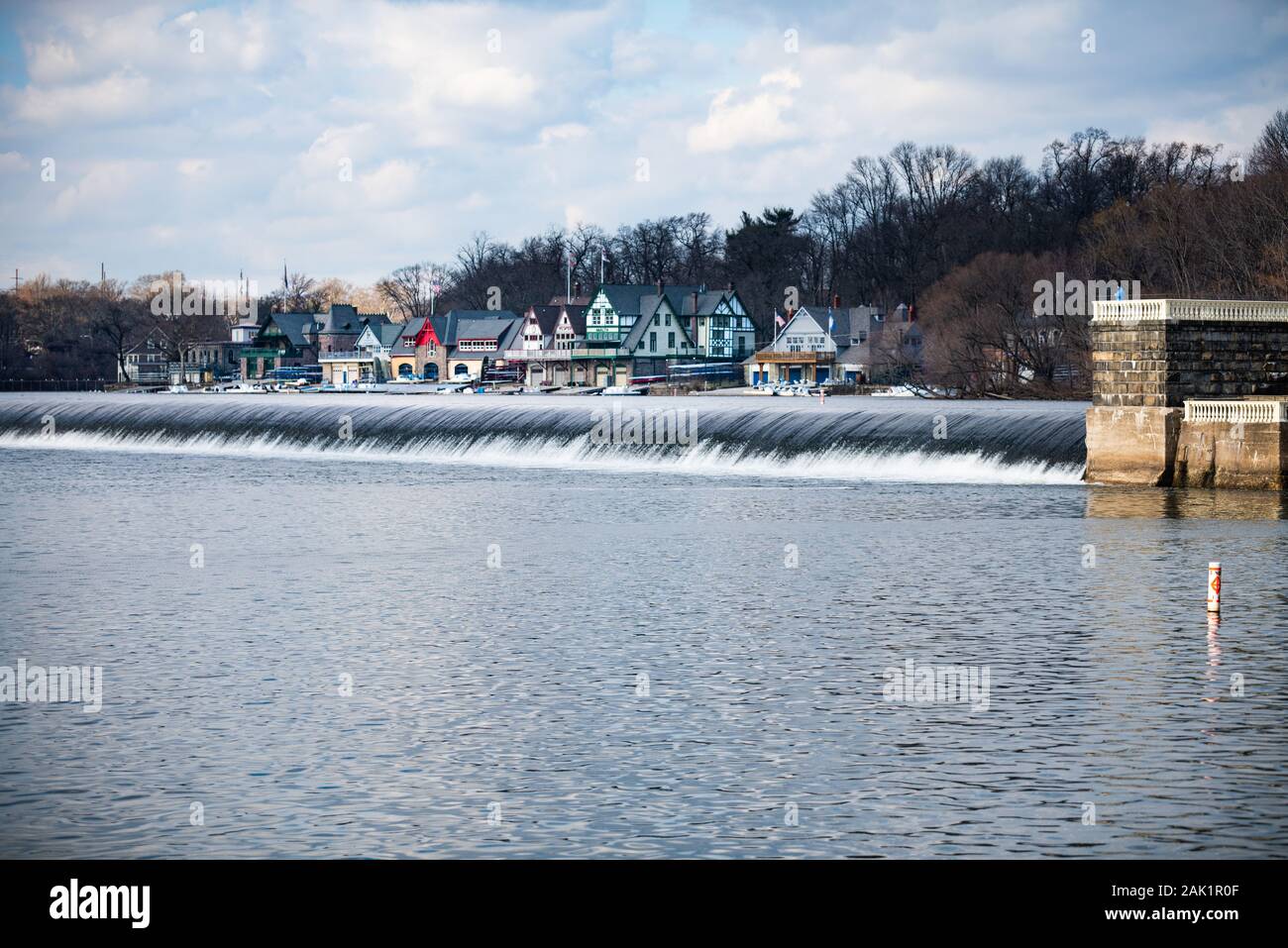 A view of Philadelphia's famous Boathouse Row visible behind the weir ...
