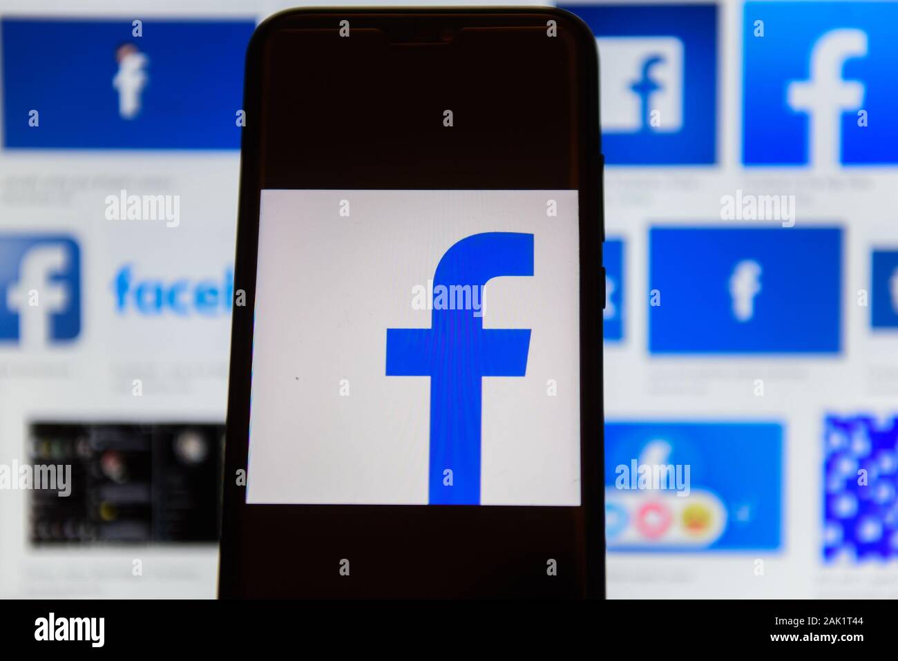 In this photo illustration a Facebook logo seen displayed on a ...