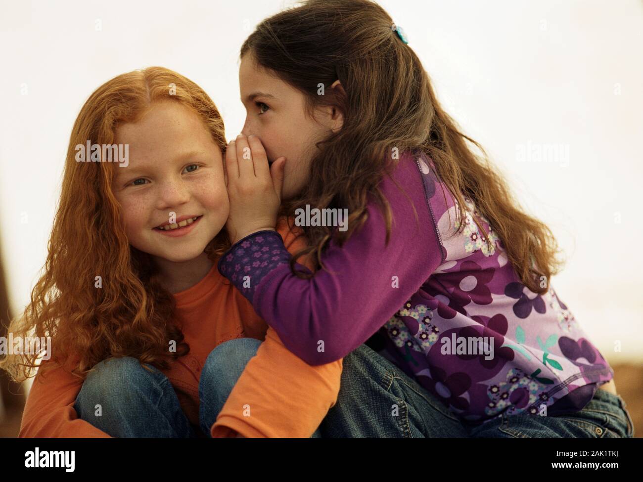 Kids whispering outdoors hi-res stock photography and images - Alamy