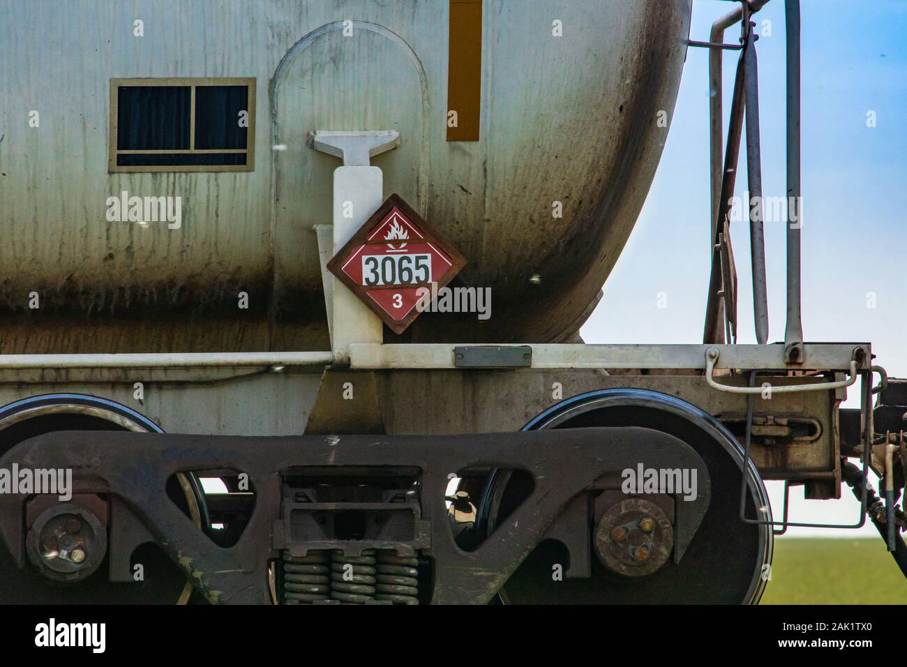 Close up of the tank car of a canadian freight train with 3065 warning ...