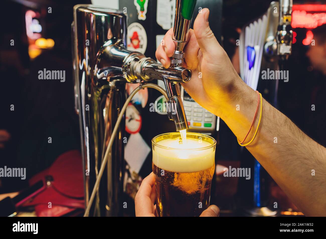 Mans hand pouring alcohol hi-res stock photography and images - Alamy