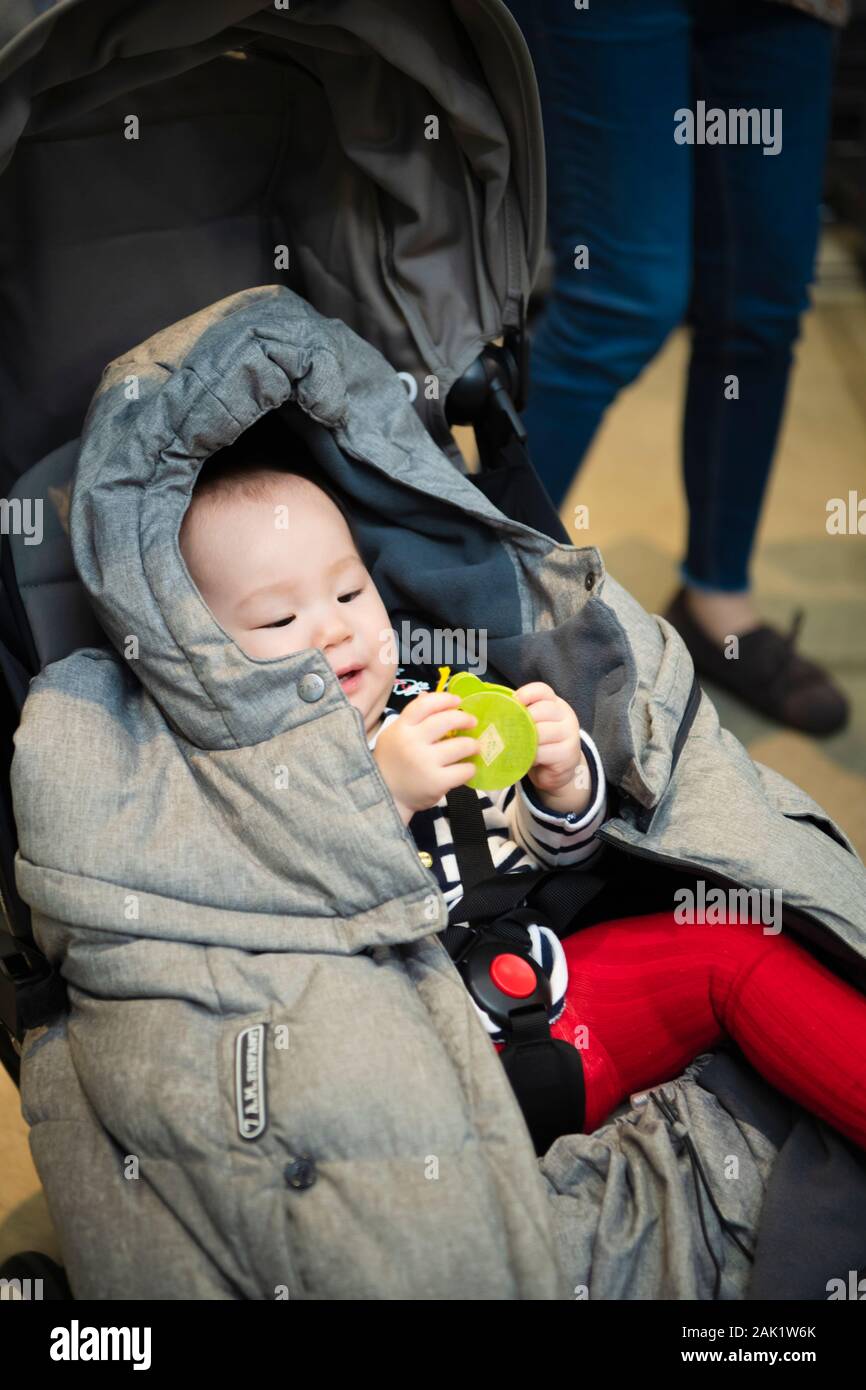 Baby sleeping in stroller Stock Photo - Alamy