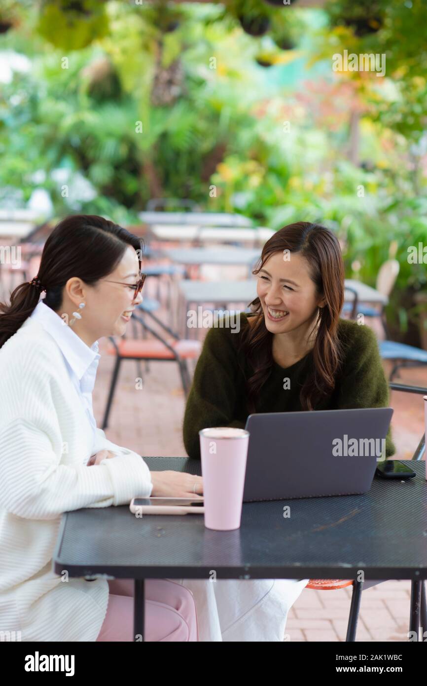 Two women having meeting in open space office Stock Photo - Alamy