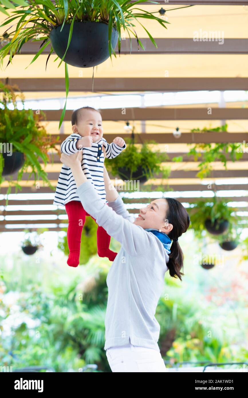 Woman caressing baby Stock Photo - Alamy