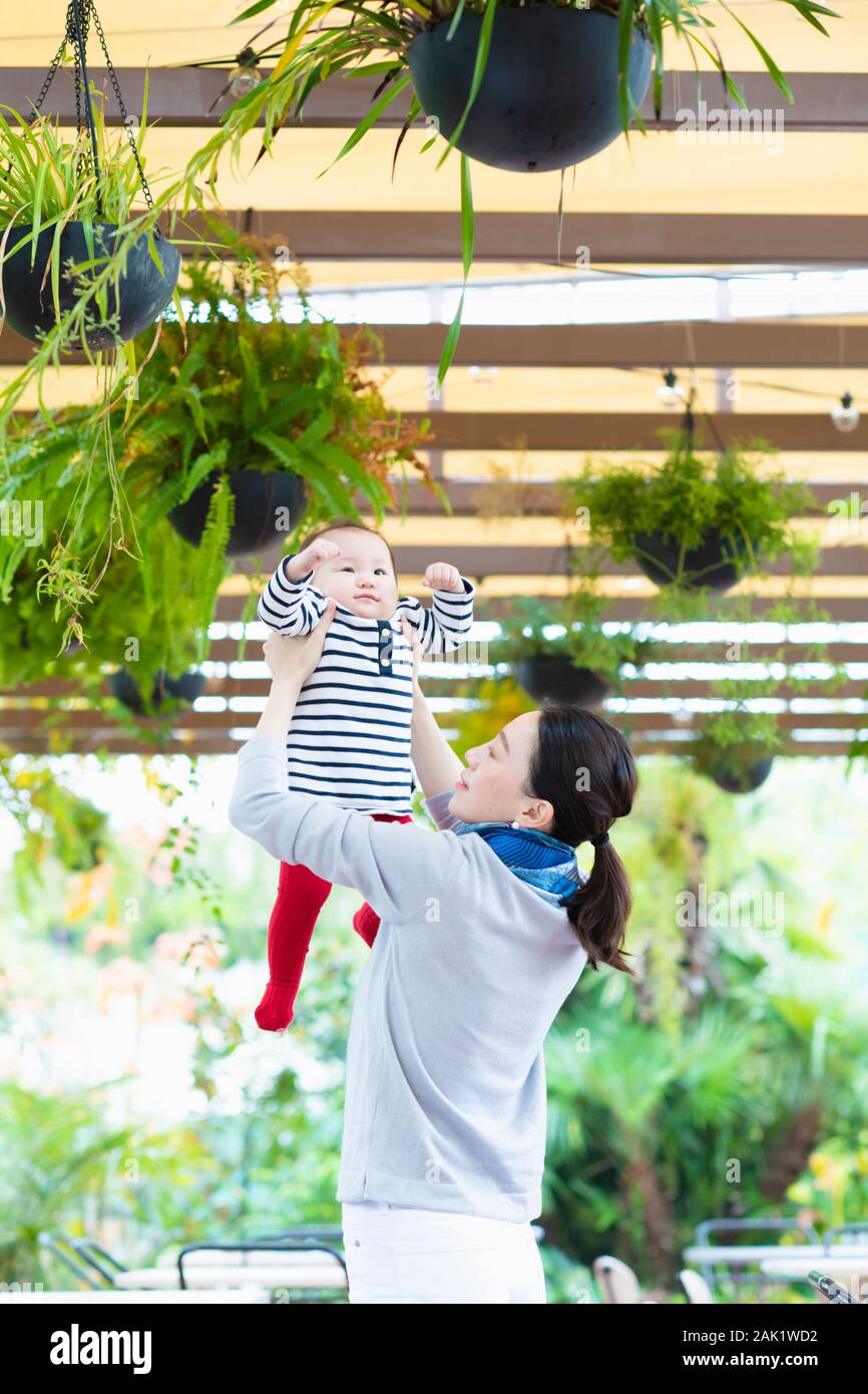 Woman caressing baby Stock Photo - Alamy
