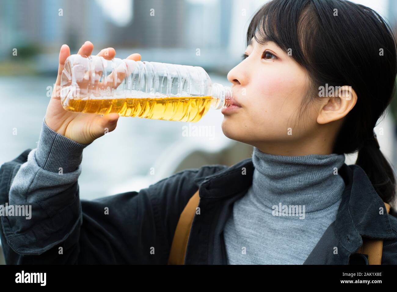 Woman drinking mugicha, Japanese roasted and iced barley tea Stock ...