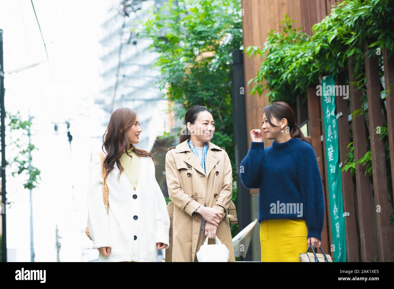 Women walking through town hi-res stock photography and images - Alamy