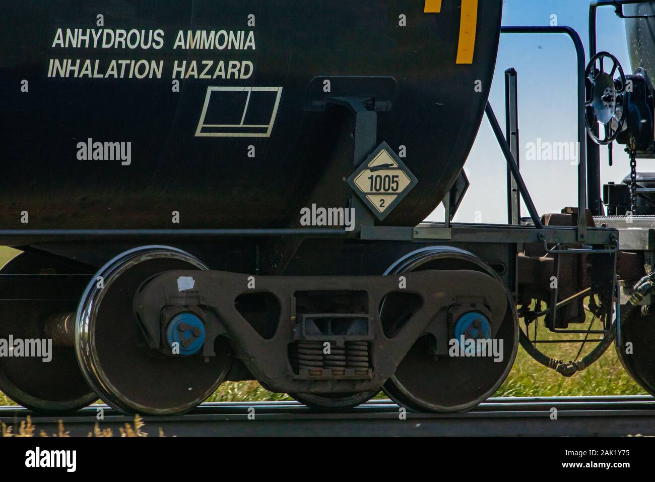 Close up of the tank car of a canadian freight train with 1005 warning ...