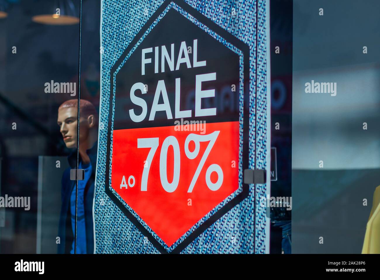 Storefronts with sale sign behind the glass window Stock Photo - Alamy