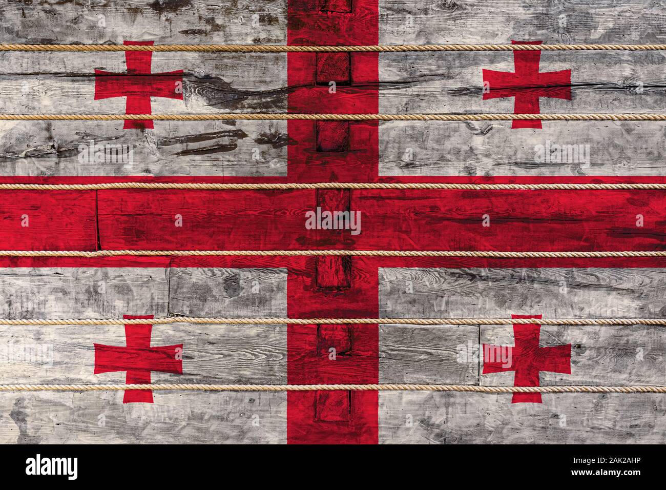 National flag of Georgia on a wooden wall background. The concept of ...