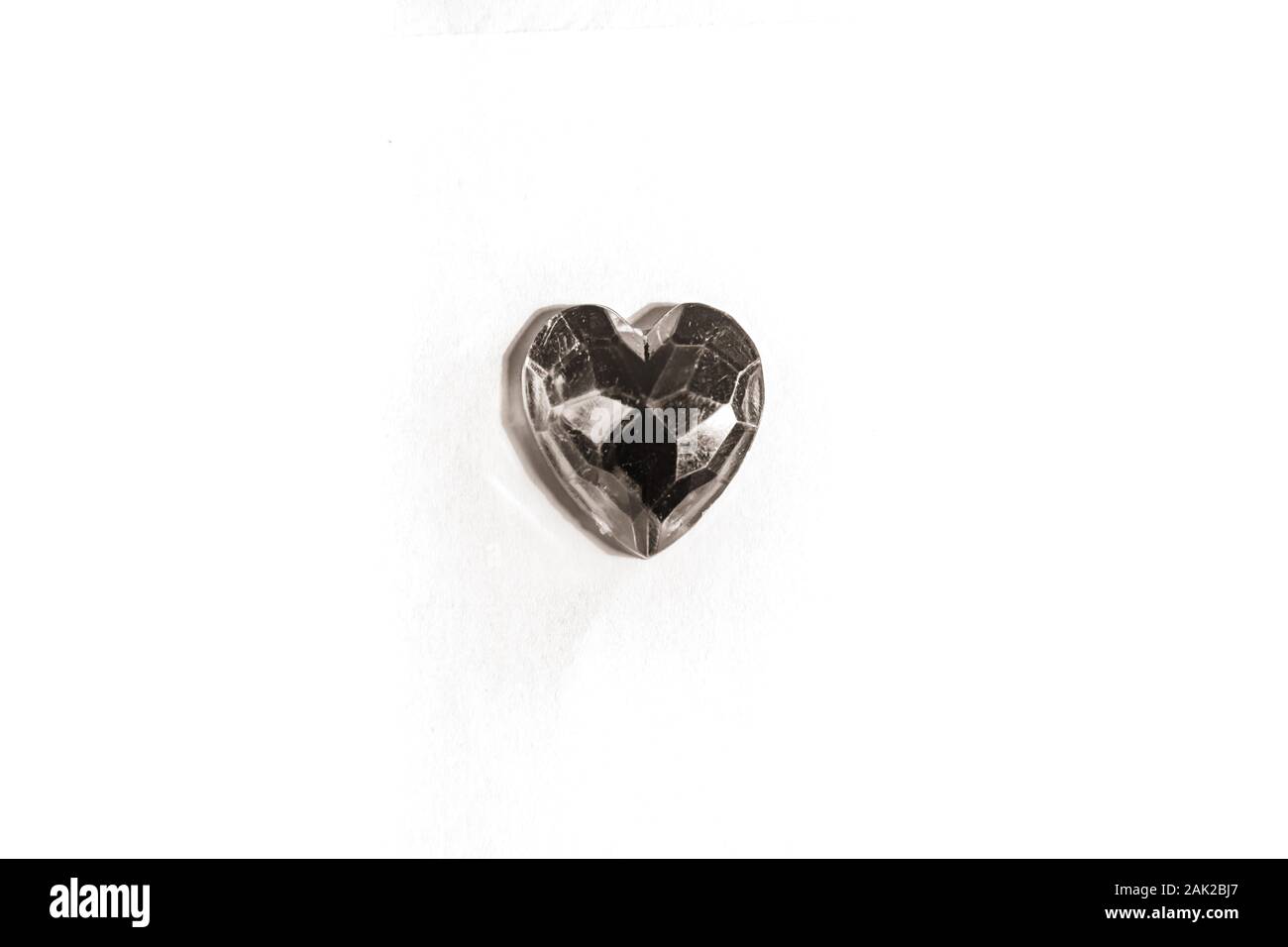 silver heart shaped diamond issolated on white background Stock Photo ...