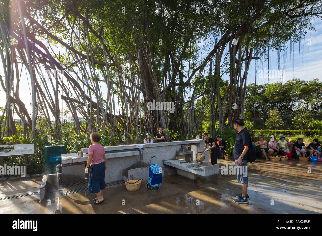 Crowded scene of people are collecting hot spring water at the ...