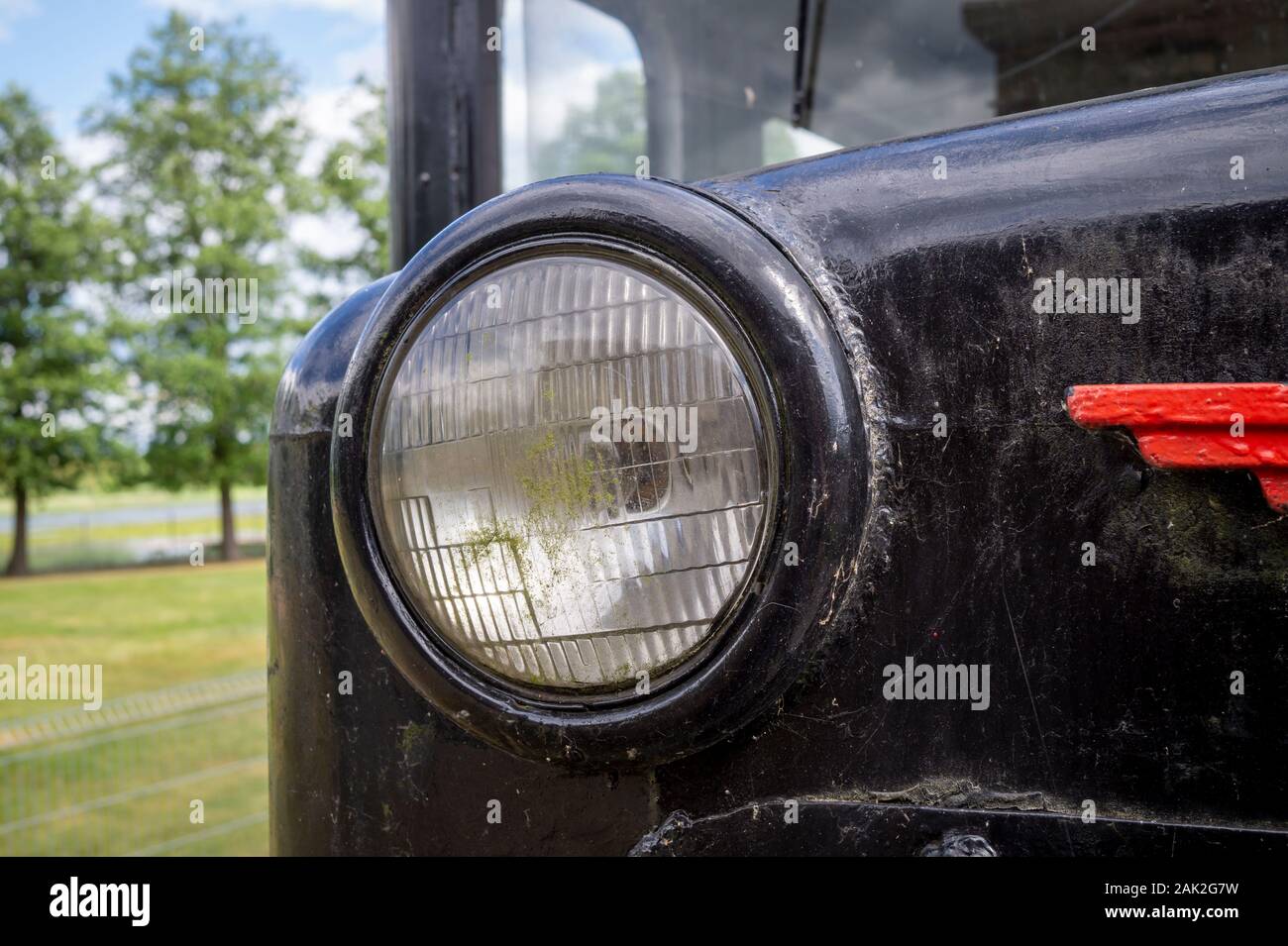 Headlight of old vintage locomotive train painted black with red ...