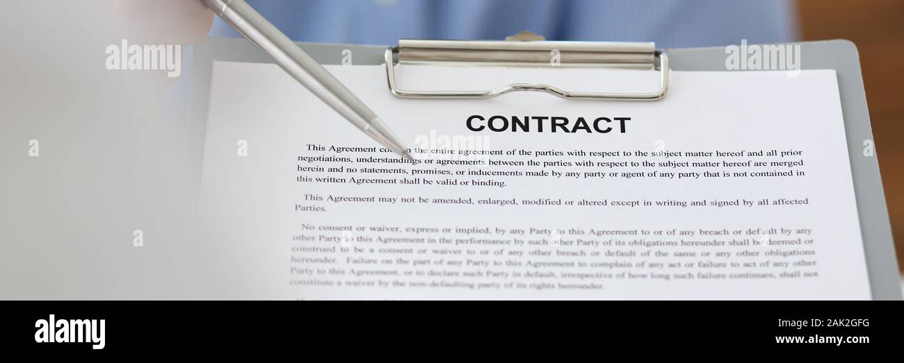 Female arm in suit offer contract form on clipboard pad Stock Photo - Alamy