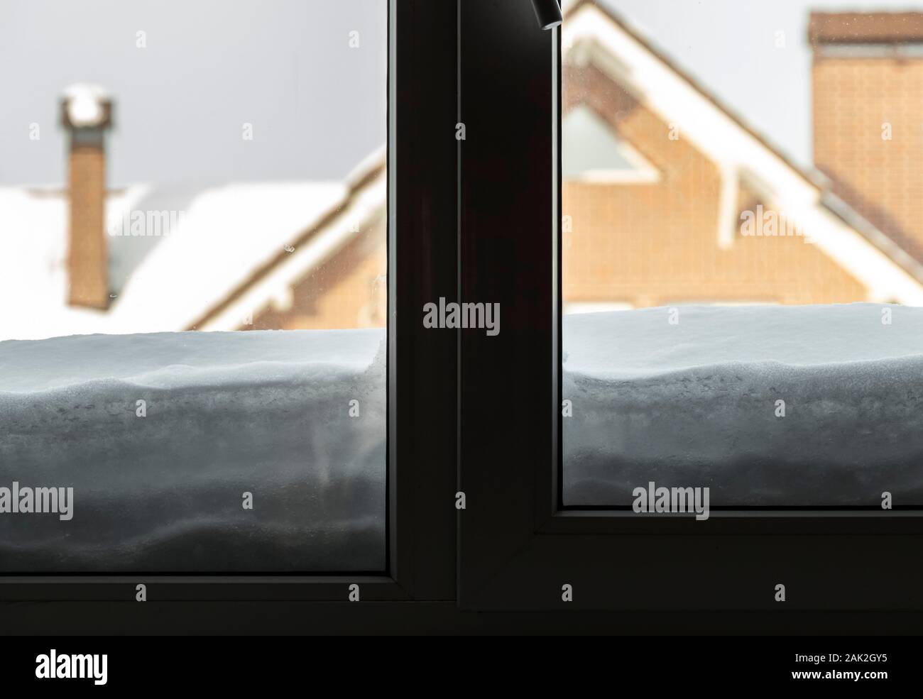 A thick layer of snow lies outside the window Stock Photo - Alamy